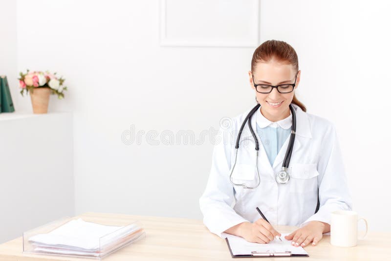 Professional Doctor Sitting at the Table Stock Photo - Image of ...