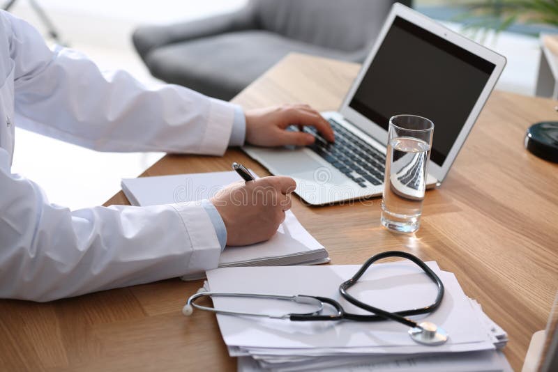 Professional Doctor Working on Laptop in Office Stock Image - Image of ...