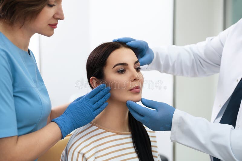 Doctors Examining Patient before Surgery in Clinic Stock Photo - Image ...