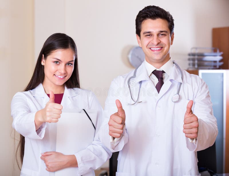 Professional Doctors Smiling in Clinic Stock Photo - Image of ...