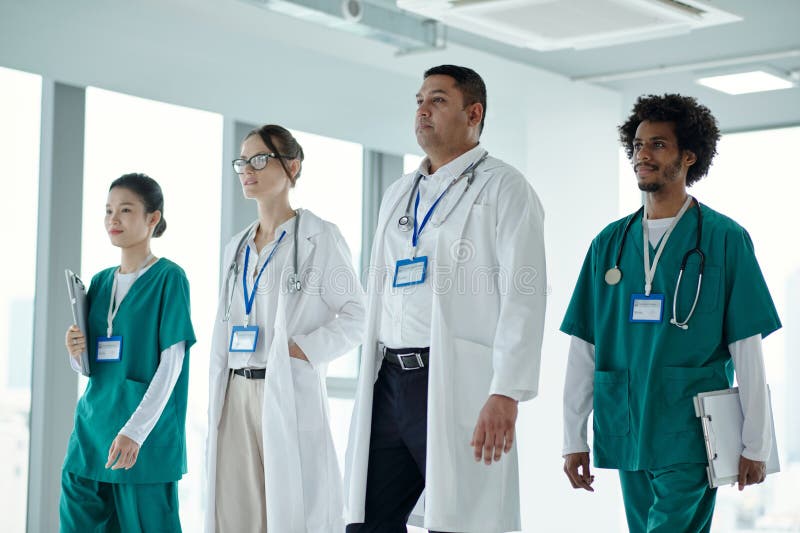 Professional Doctors Walking in Hospital Corridor Stock Photo - Image ...