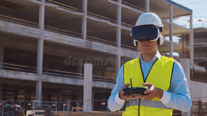 Professional Drone Operator in Virtual Reality Helmet Standing in Front ...