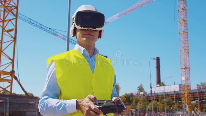 Professional Drone Operator in Virtual Reality Helmet Standing in Front ...