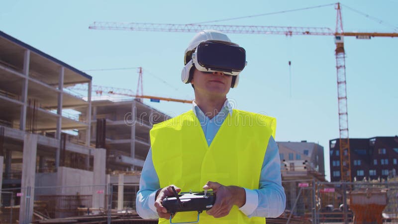 Professional Drone Operator in Virtual Reality Helmet Standing in Front ...