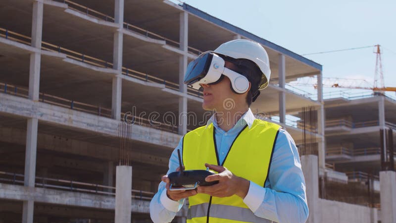 Professional Drone Operator in Virtual Reality Helmet Standing in Front ...