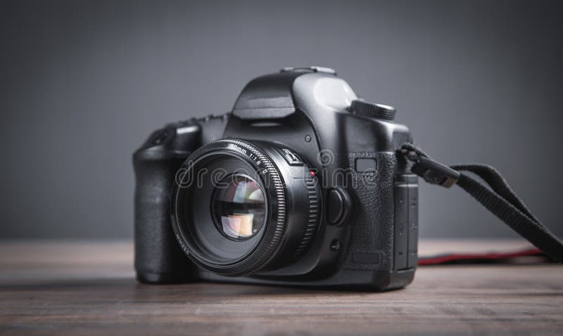 Professional DSLR Camera on the Wooden Table Stock Photo - Image of ...