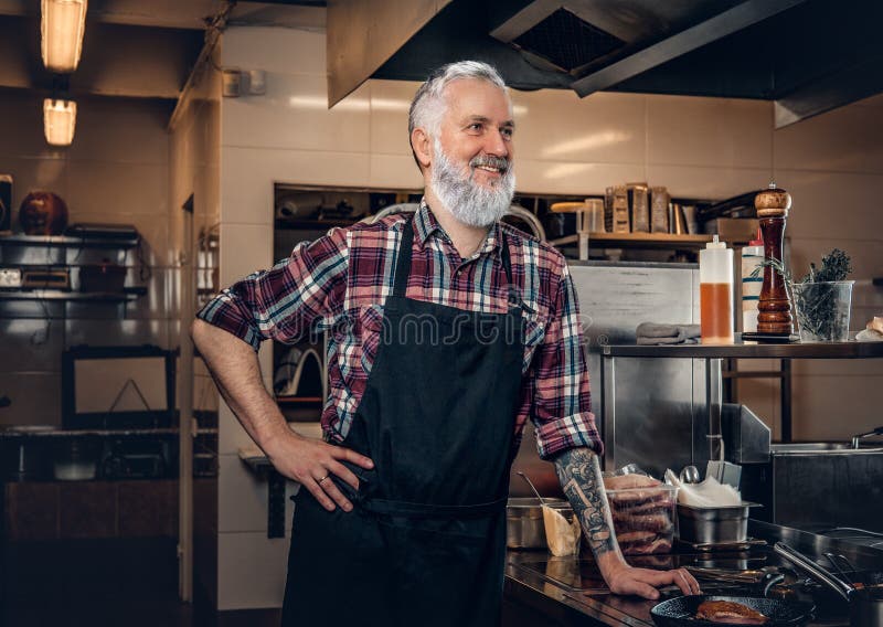 Professional Elderly Butcher Inside Modern Kitchen of Restaurant Stock ...