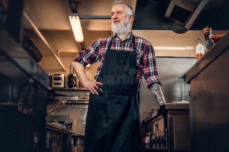 Professional Elderly Butcher Inside Modern Kitchen of Restaurant Stock ...