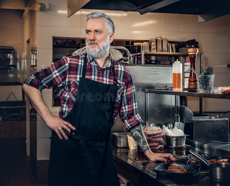 Confident Elderly Butcher with Apron Posing with Crossed Arms Stock ...