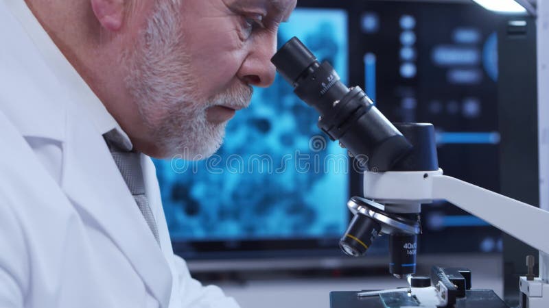 Elderly Professor is Doing a Science Experiment in a Modern Laboratory ...