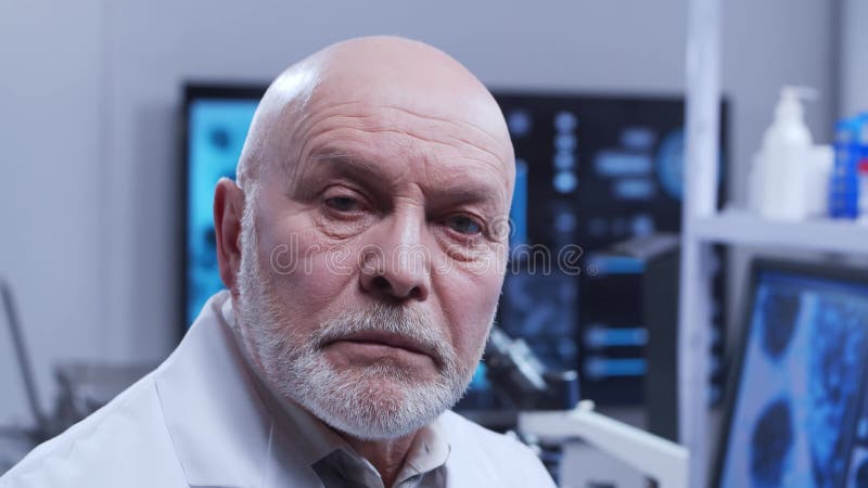 Elderly Professor is Doing a Science Experiment in a Modern Laboratory ...