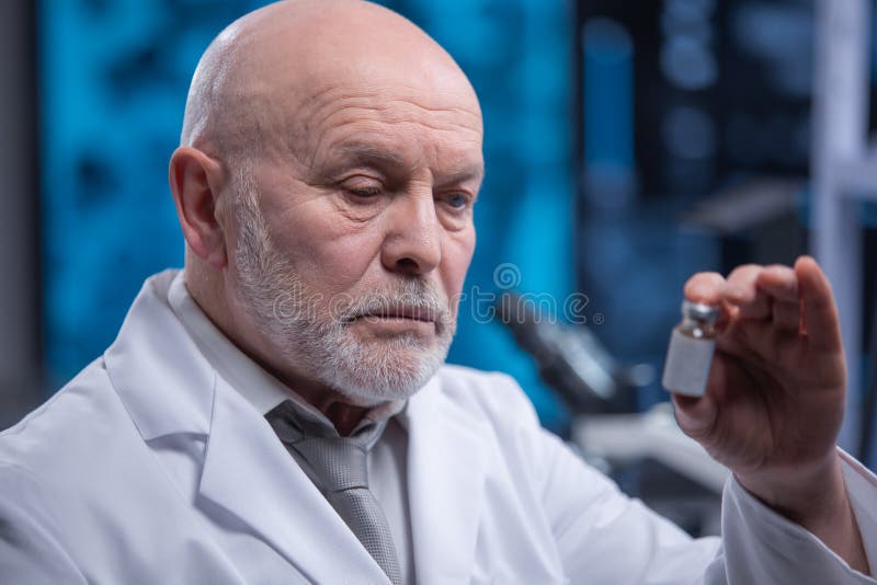 Elderly Professor is Doing a Science Experiment in a Modern Laboratory ...