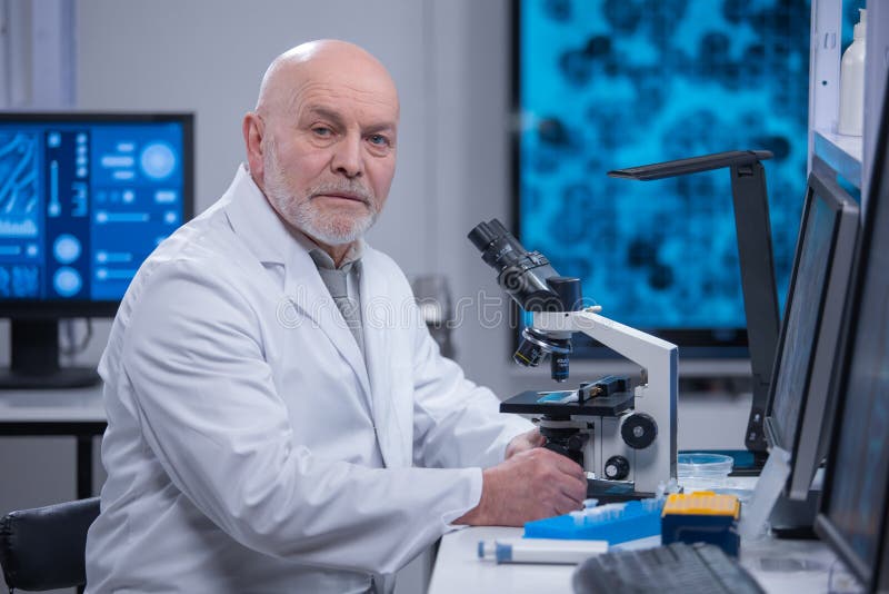 Elderly Professor is Doing a Science Experiment in a Modern Laboratory ...