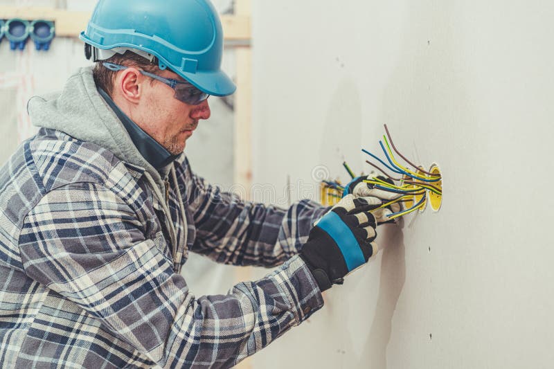 Skilled Electrician Works on Wiring Installation in a Modern Building ...