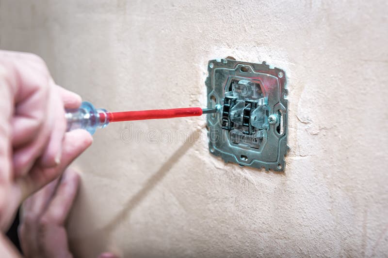 Electrician Inserts an Electrical Outlet into the Socket Box Stock ...