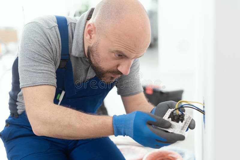Professional Electrician Installing a Wall Socket Stock Photo - Image ...