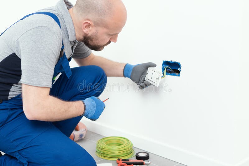 Professional Electrician Installing a Wall Socket Stock Image - Image ...