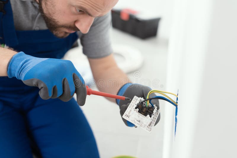 Professional Electrician Installing a Wall Socket Stock Photo - Image ...