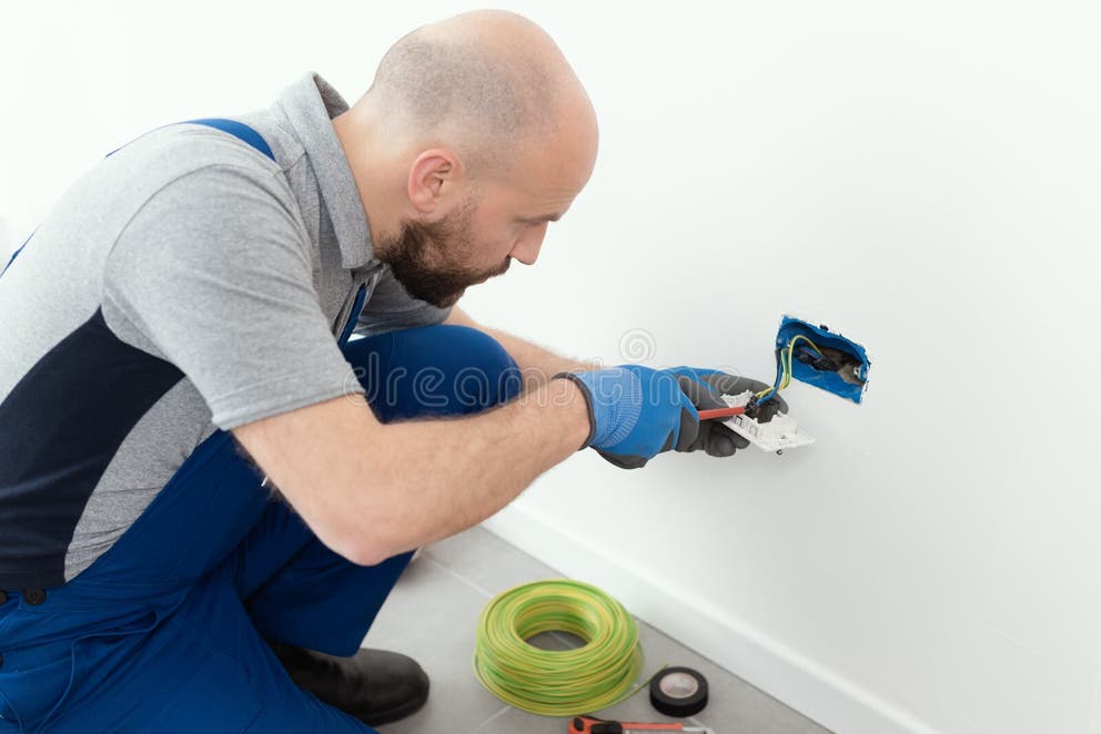 Professional Electrician Installing a Wall Socket Stock Photo - Image ...