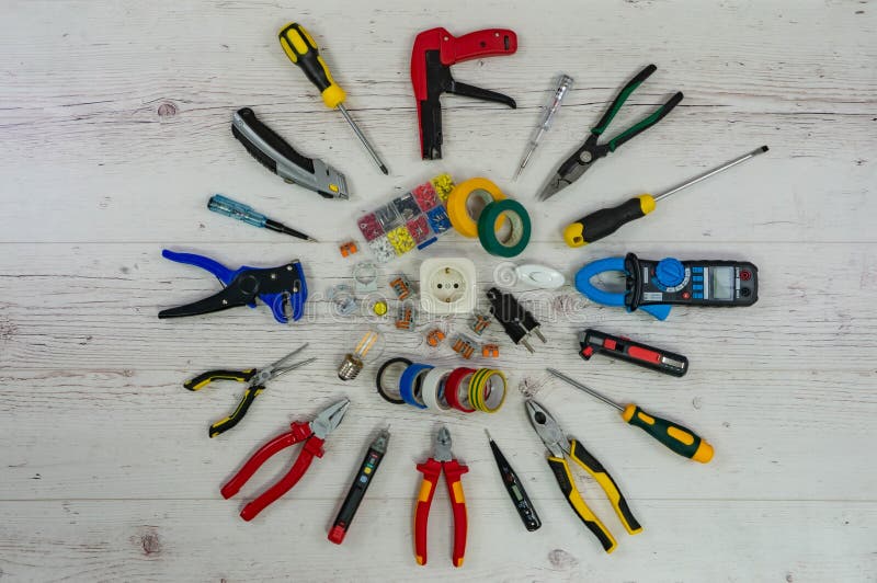 Red Professional Electrician Tools on Light Wood Background. Top View ...
