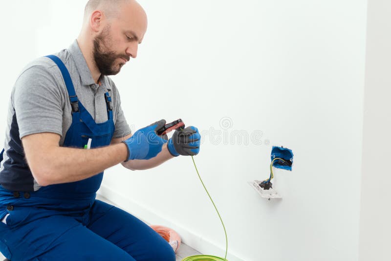 Professional Electrician Working on the Electrical System Stock Image ...
