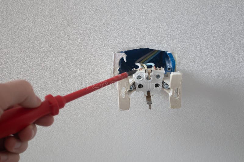 Professional Electrician Working on a Home Electrical System is ...