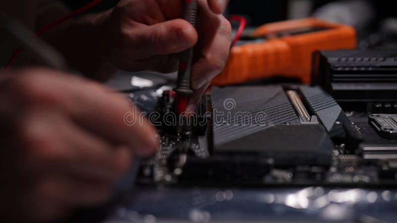Professional Electronic Engineer Using Multimeter To Measure Voltage on ...