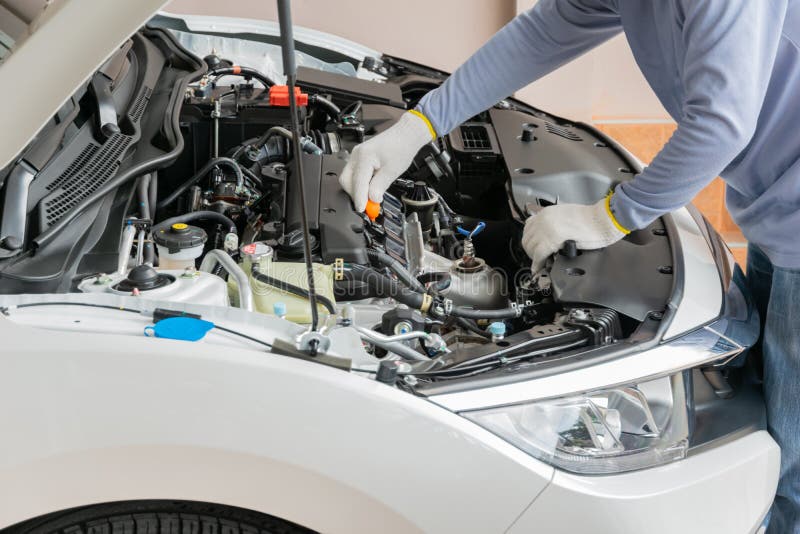 Professional Engine Engineering is Checking Car Engine at Service Stock ...