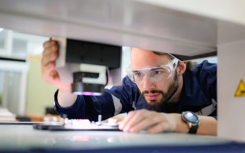 Professional Engineer Checking and Repairing Part of Automatic Machine ...