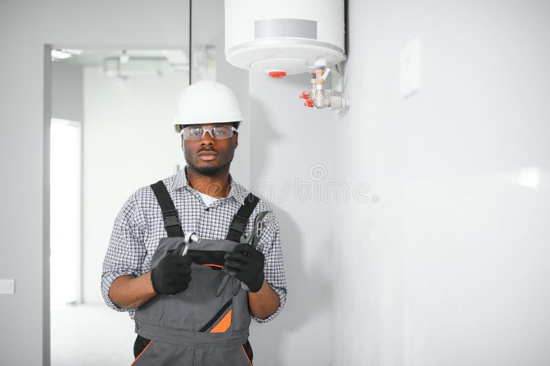 Professional African American Engineer Doing a Boiler Inspection at ...