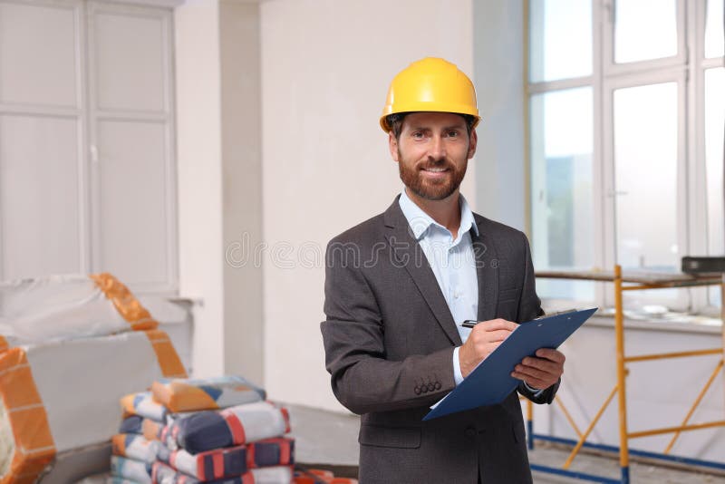 Professional Engineer in Hard Hat with Clipboard Indoors Stock Image ...