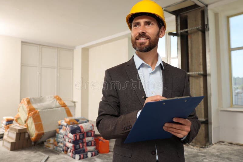 Professional Engineer in Hard Hat with Clipboard Indoors Stock Image ...
