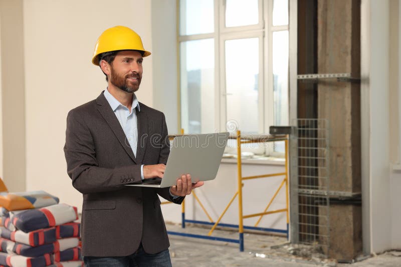 Professional Engineer in Hard Hat with Laptop Indoors Stock Image ...