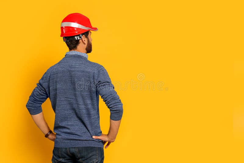 Professional Engineer in Hard Hat on Yellow Background, Back View ...