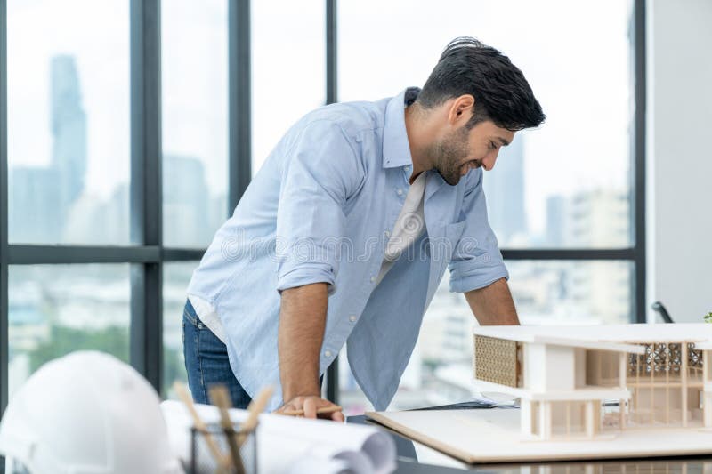 Professional Engineer Inspecting House Model while Designing Building ...