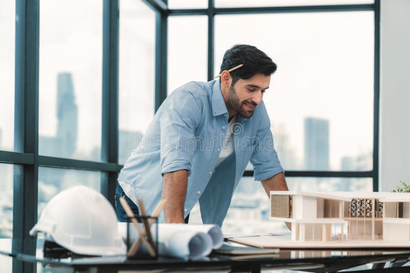 Professional Engineer Inspecting House Model while Designing Building ...