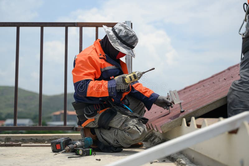 Professional Engineer Worker Installing Solar Panels System on Rooftop ...