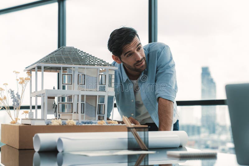 Professional Engineer Working with House Model Turning Face at Laptop ...