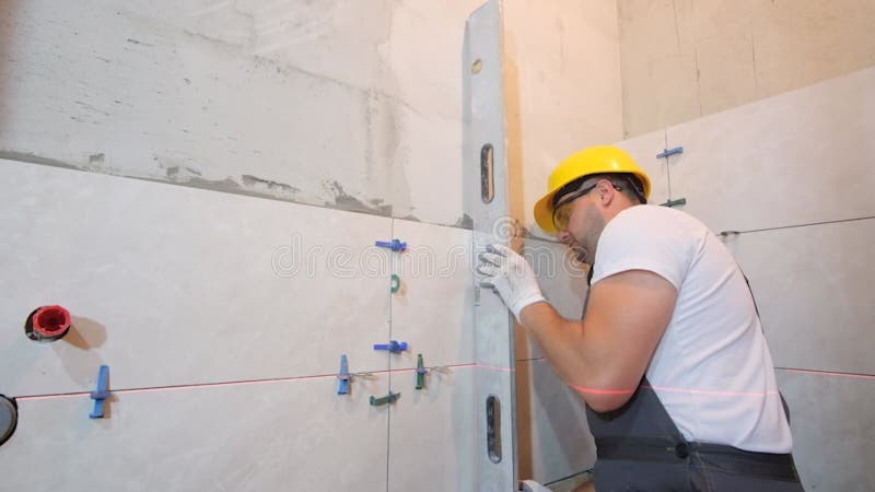 Installation of Ceramic Tile on Floor in Flat in Building Under ...