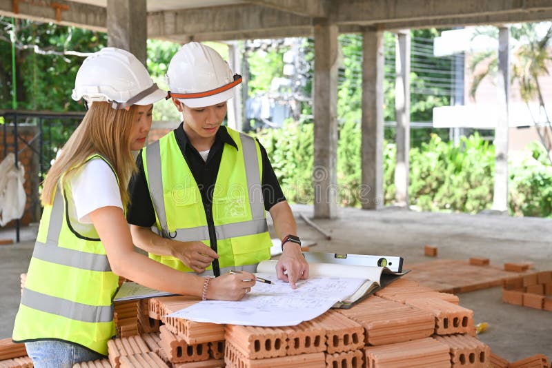 Professional Engineering Team Working at Construction Site Together ...