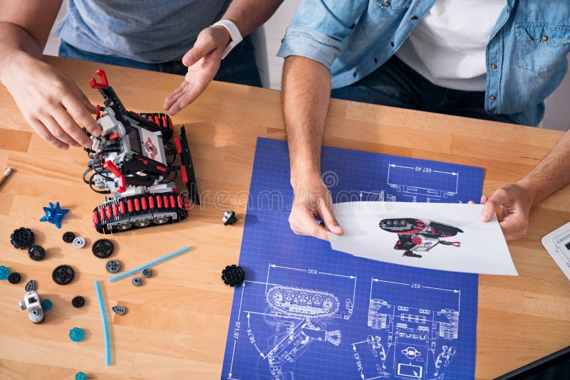 Professional Engineers Constructing Robot Stock Photo - Image of tech ...