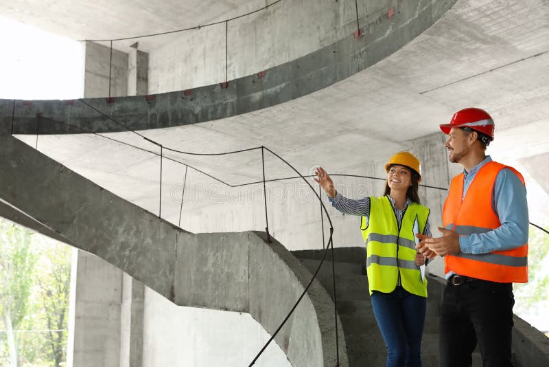 Professional Engineers in Safety Equipment at Construction Site Stock ...