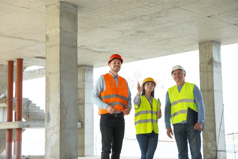 Professional Engineers in Safety Equipment at Construction Site Stock ...