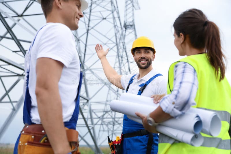 Professional Engineers Working on Installation of Electrical Substation ...