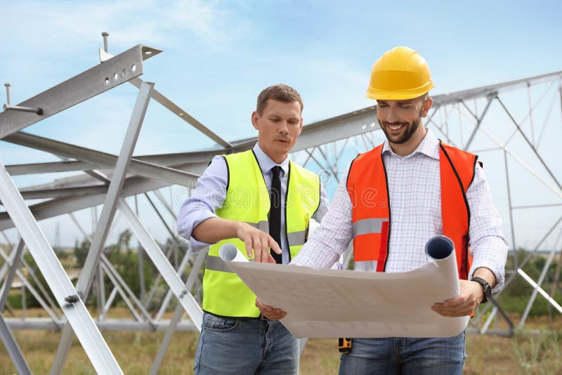 Professional Engineers Working on Installation of Electrical Substation ...