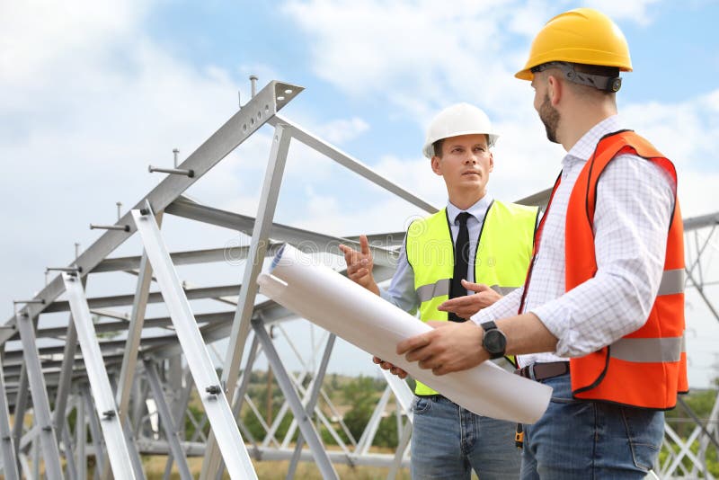 Professional Engineers Working on Installation of Electrical Substation ...