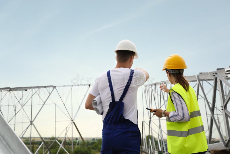 Professional Engineers Working on Installation of Electrical Substation ...