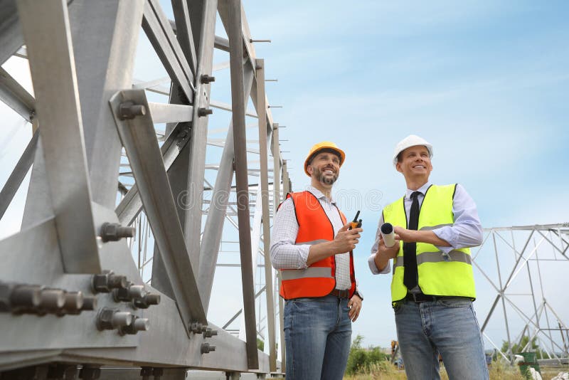 Professional Engineers Working on Installation of Electrical Substation ...