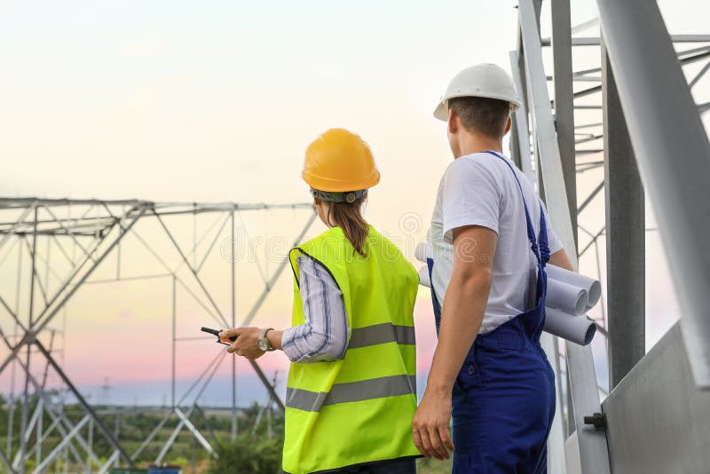 Professional Engineers Working on Installation of Electrical Substation ...