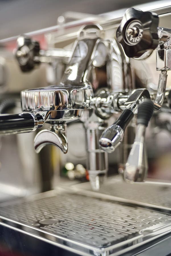 Professional Espresso Machine for Brewing Coffee. Coffee is Poured into ...